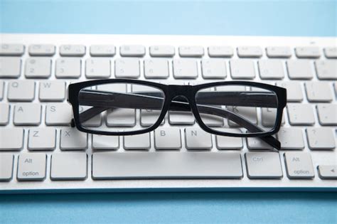 Premium Photo Black Eyeglasses On The Computer Keyboard