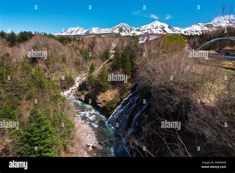 Shirahige Waterfalls And The Tokachi Mountain Range Stock Photo Alamy