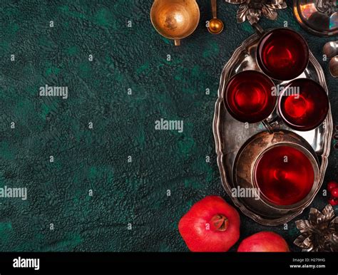 Pomegranates And Pomegranate Juice On Textural Background Top View With
