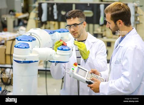 Two Arm Robot For Industrial Handling Researchers Working On Robot