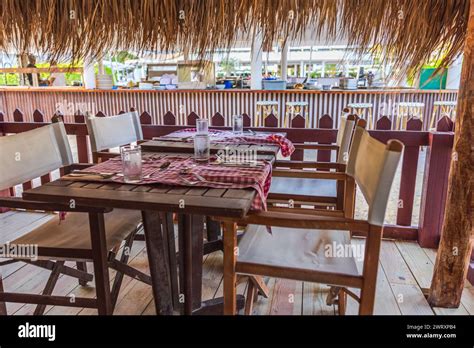 Close Up View Of Water Filled Glasses On Restaurant Tables Set For