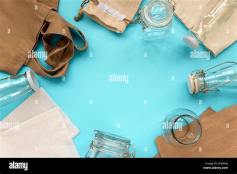 Textile Eco Bags Paper Packages And Glass Jars Lying On Blue Background Eco Friendly Reuse Or