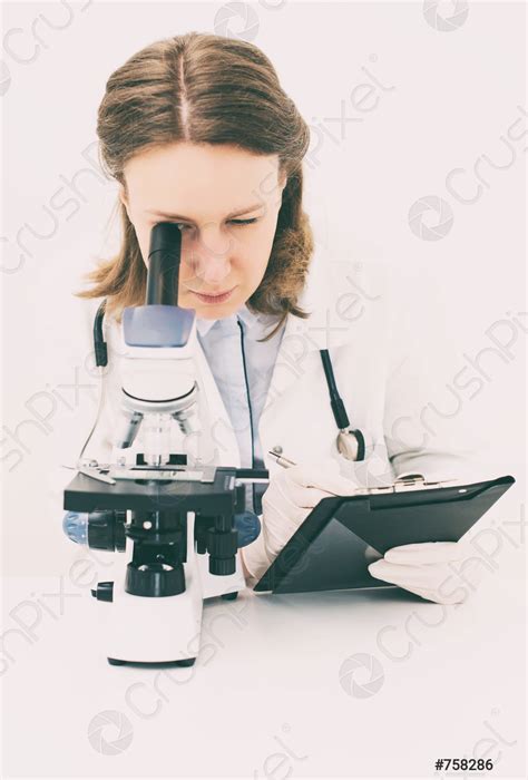 Doctor Using Microscope In Laboratory Space For Text Stock Photo Crushpixel