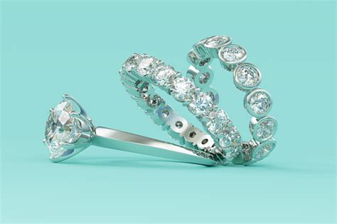 카드 놀이 다이아몬드 약혼 반지 청록색 배경에 두 개의 영원 반지 0명에 대한 스톡 사진 및 기타 이미지 0명 귀한 보석