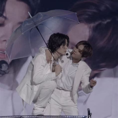 Two People Under Umbrella With Elvis Presley Image