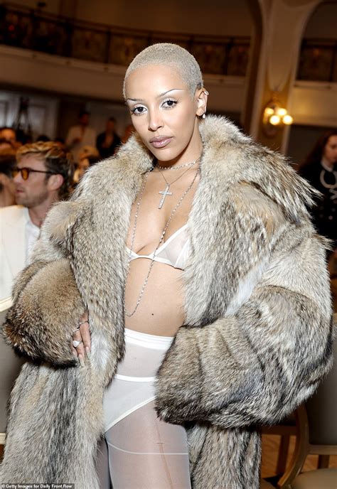 Doja Cat Has A Glass Of Wine In Hand While Posing On The Red Carpet In Lingerie And A Fur Coat
