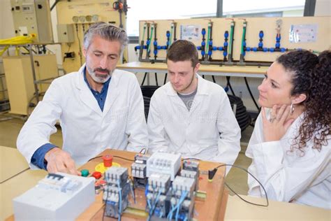 Babes And Teacher Looking At Electronic Circuit Board Stock Photo Image Of Assembling