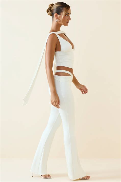 Shadi Tall Cut Out Mid Rise Flared Trousers In Vanilla Oh Polly