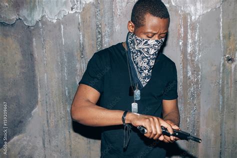 Black Gang Member Checks His Weapon Gangster Man With Gun In Hand On