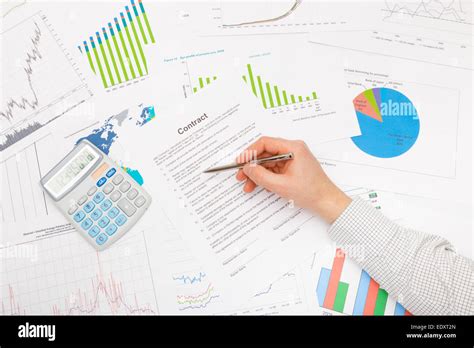 Male Hand And Financial Charts And Graphs Stock Photo Alamy