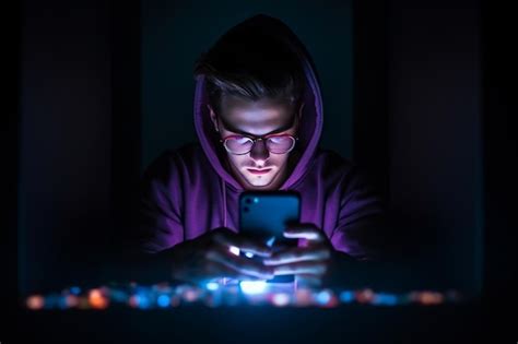 Man Scrolling Mobile Phone Screen In Dark Room Generative Ai Premium