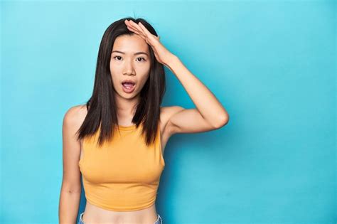 Premium Photo Asian Woman In Summer Yellow Top Studio Setup Shouts Loud Keeps Eyes Opened And