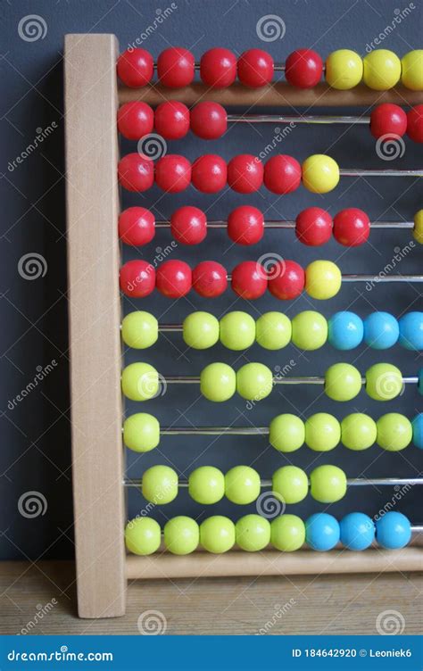 Calculating With Beads On Wooden Rainbow Abacus For Number Calculation