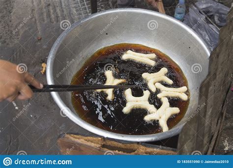 Fritters Frying In An Oil In A Frying Pan At A Street Stall In Phnom