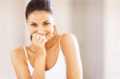 Image Of Young Woman Covering Her Mouth While Laughing 950686 Stock