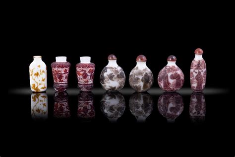 At Auction A Group Of Seven Overlay Glass Snuff Bottles