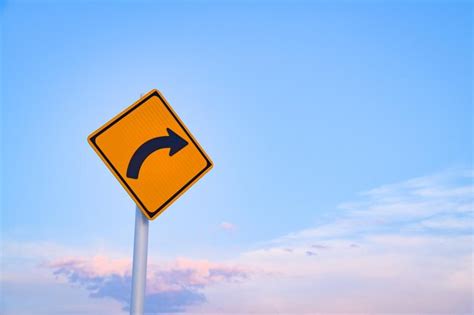 Premium Photo Curve Caution Road Sign Standing In The Sky