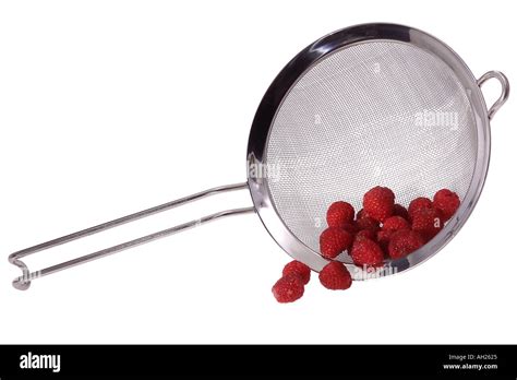 Wire Mesh Colander With Berries Silhouetted On White Background Stock