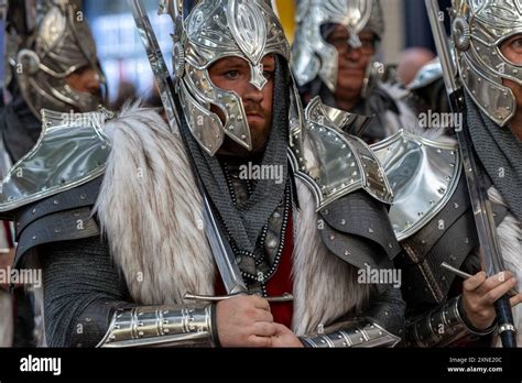 This Image Captures A Group Of Individuals Dressed As Knights Adorned