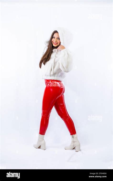 Latina Woman With Black Hair Wearing A White Wool Sweater And Red Latex