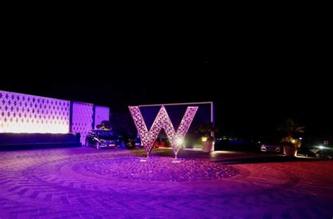 The Entrance To An Event With Purple Lighting