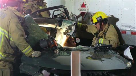 Car Pinned Under Semi Truck Firefighters Rescue Woman Youtube