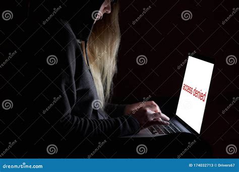 Overhead Hacker In The Hood Working With Laptop Typing Text In The Darkroom Stock Image Image
