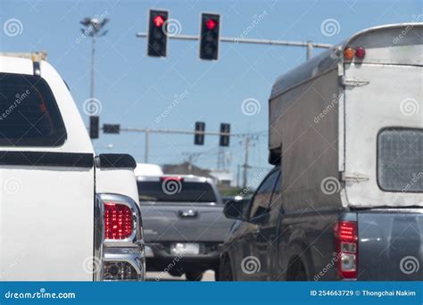 Rear Side Of Pick Up White Car Stops On The Road With Turn On Brake