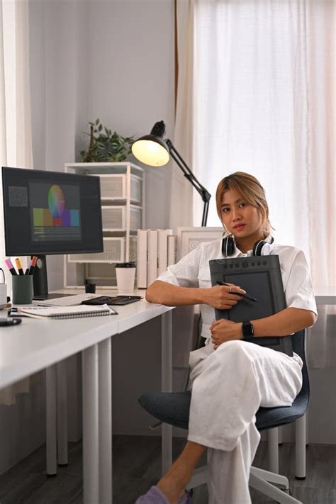 Portrait Of Young Creative Woman Sitting Front Of Computer In Modern