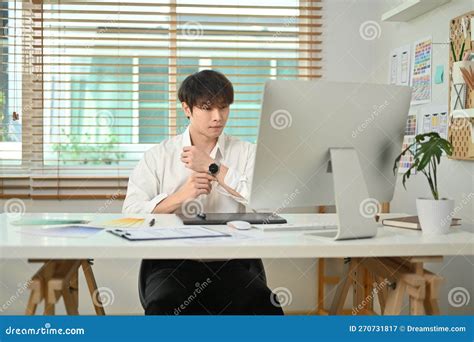 Handsome Asian Male Website Developer Working On Mobile Application Software Design Project At