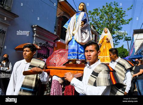 Mexican Male Devotees Carry The Religious Palanquin During During The