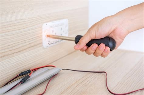 Premium Photo Man Hand Using Screwdriver Installing Wire Cables For