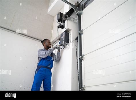 Installing Automatic Garage Door Or Gate Stock Photo Alamy