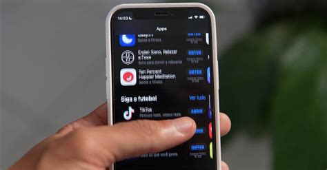 A Person Scrolling Through The App Store On A Smartphone Free Stock