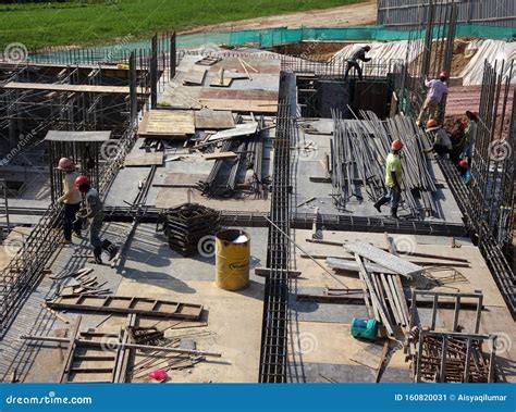 Construction Site During Daytime Workers Busy With Their Work
