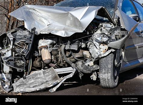 Total Loss Car Crash Showing The Damaged Engine After A Dangerous Road