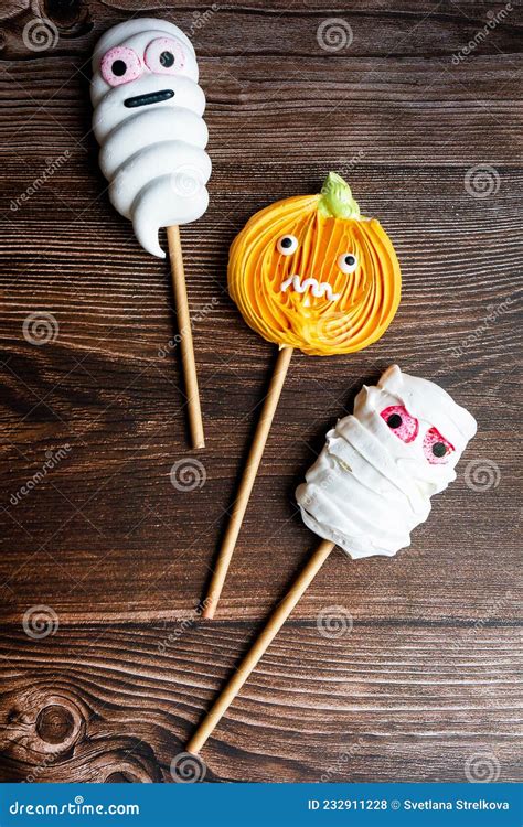 Halloween Meringue Ghost Sweets And Pumpkin Halloween Snacks Stock