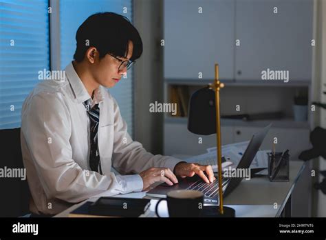 overwork concept the man sitting at his desk and focusing on working