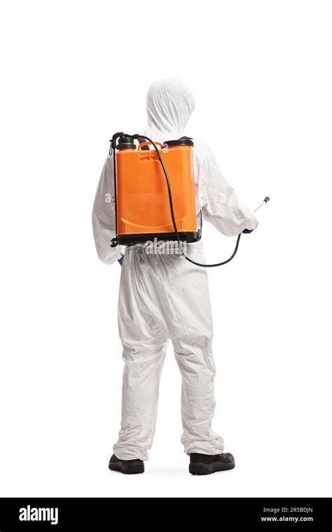 Rear View Of A Pest Controller In A Hazmat Suit Disinfecting With A