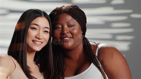 Interracial Girls Embracing And Expressing Self Confidence Stock
