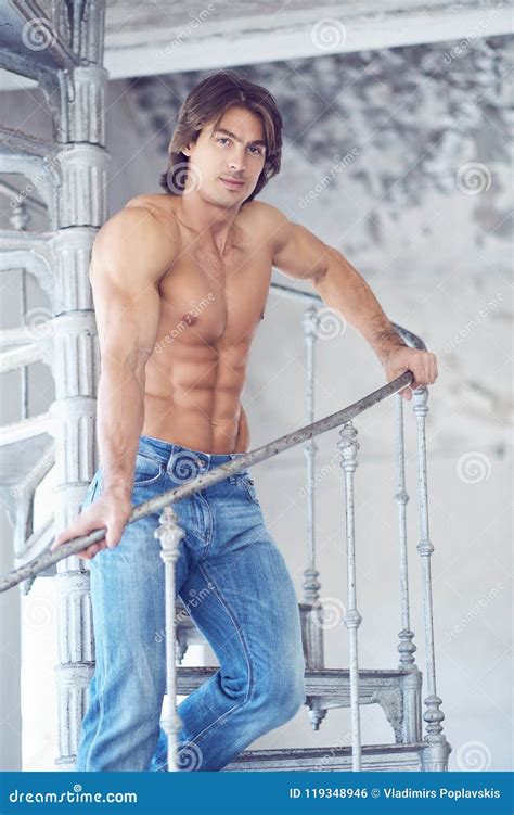 Shirtless Handsome Male With A Perfect Muscular Body Posing On Stairs