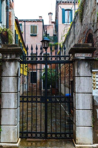 Premium Photo Closed Gate Against Built Structures