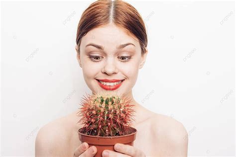 Woman Holding A Cactus With Exposed Shoulders Eyelashes Closeup Cactus