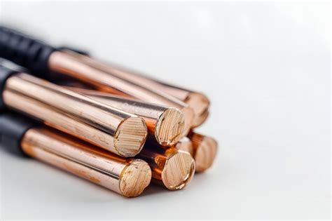 Premium Photo Copper Multicore Cable Ends Stacked On A White Surface