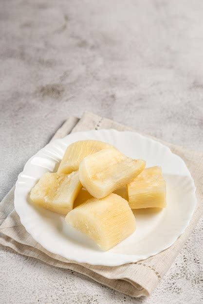 Premium Photo Cooked Cassava Served On Plate On The Table