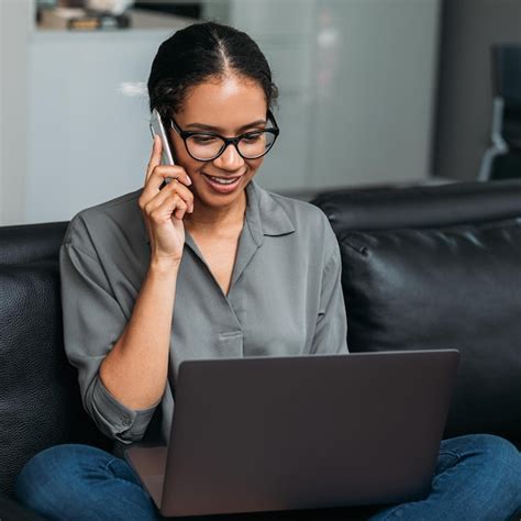 Premium Photo Young Woman Using Laptop While Sitting At Home