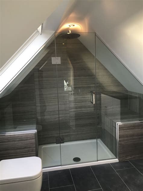 A Bathroom With A Toilet Sink And Shower In Its Attic Style Home