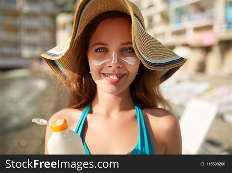 Suntan Lotion Woman Applying Sunscreen Solar Cream On Face Beautiful