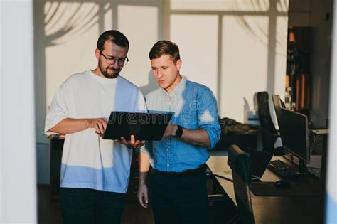 Portrait Of Two Professional Male Programmers Working On Computer In Diverse Offices Modern It