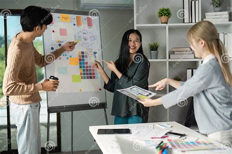 Creative Team Collaborating On Ux Ui Design Project In Modern Office